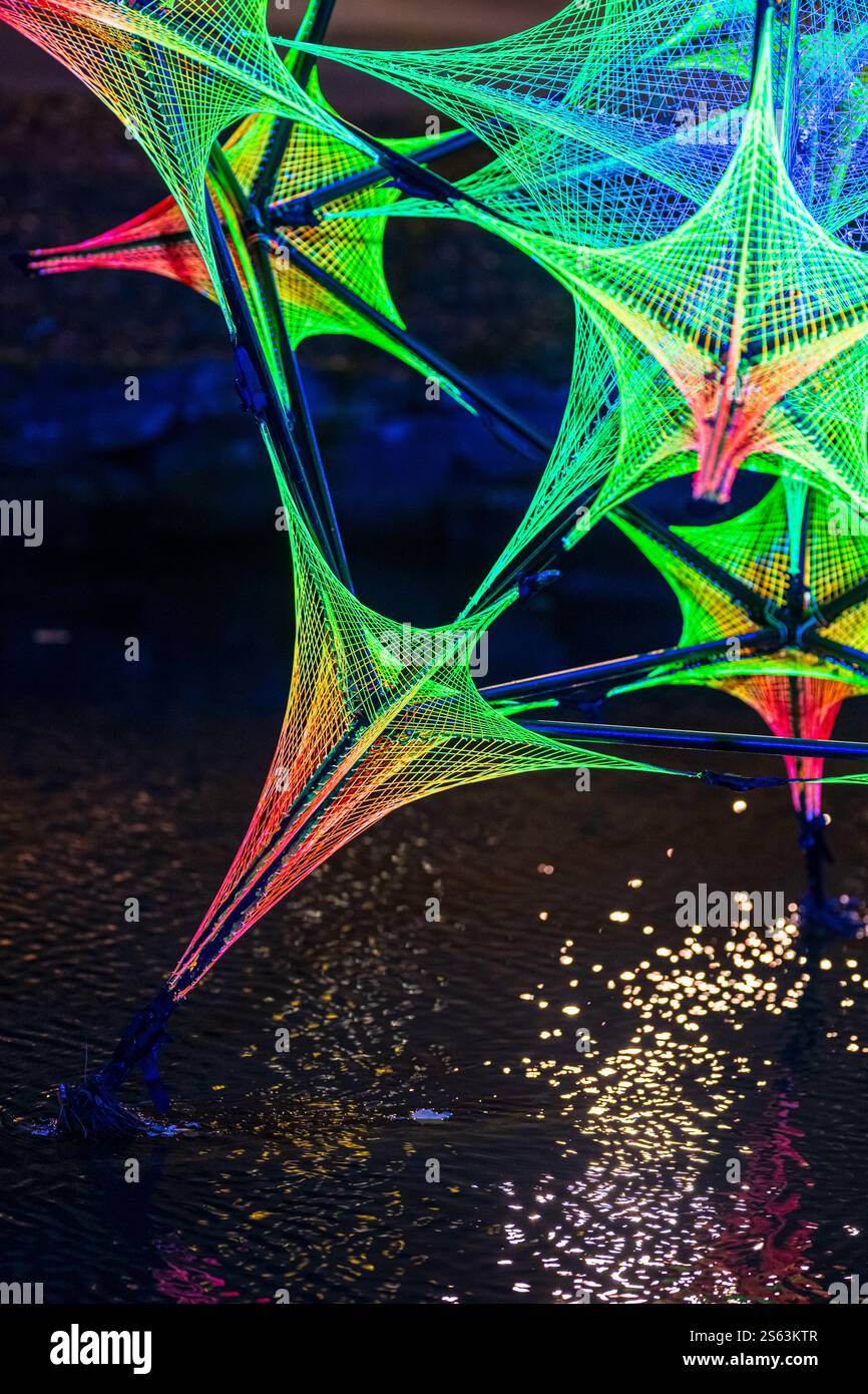 Light art installations hovering over a canal at light Stock Photo - Alamy