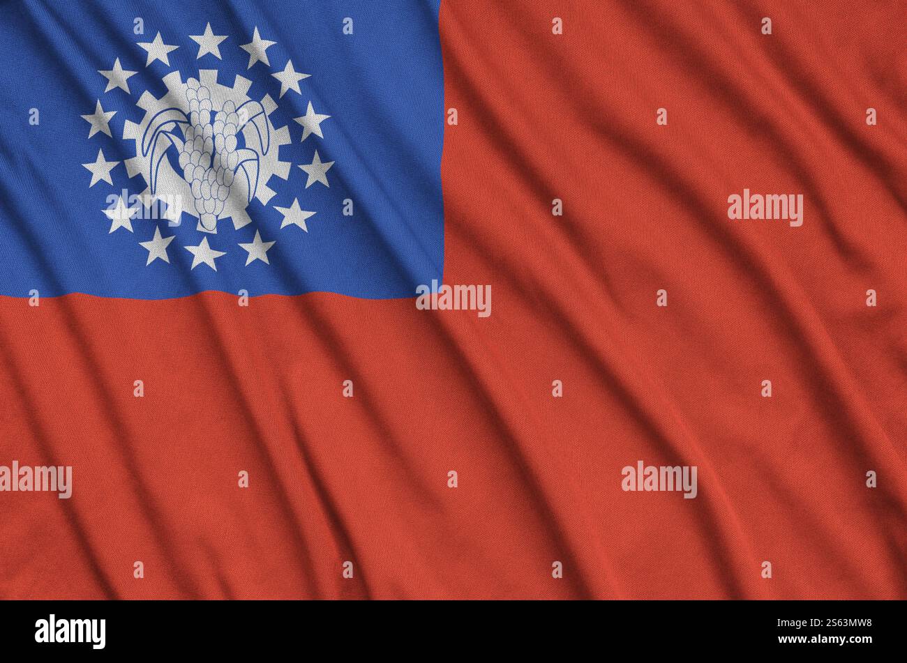 Myanmar flag is depicted on a sports cloth fabric with many folds ...