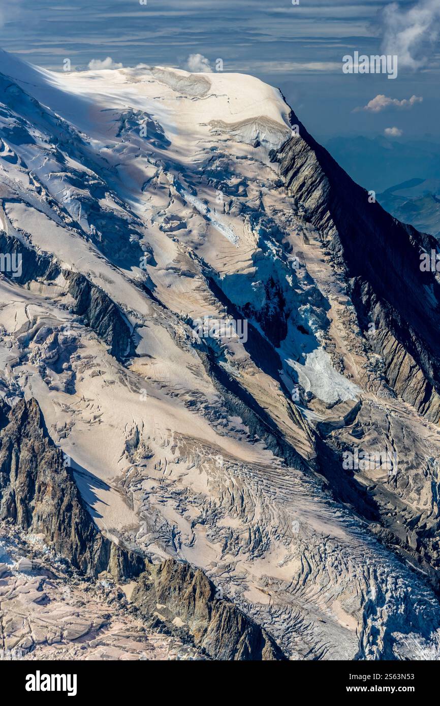 Snow mountain summits and white ice glacier in the Alps. Mont Blanc climbing route and views ...