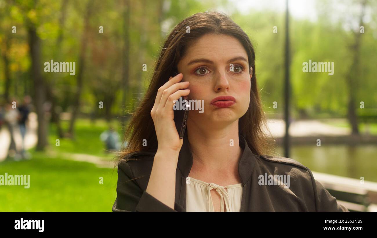 Dissatisfied woman ceo calling smartphone hi-res stock photography and images - Alamy