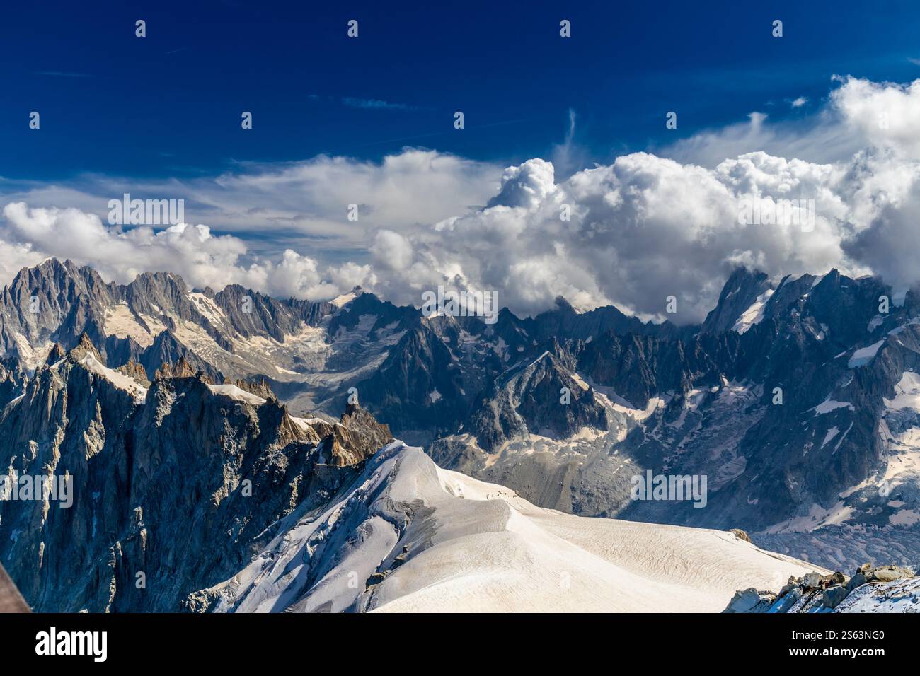Snow mountain summits and white ice glacier in the Alps. Mont Blanc climbing route and views ...