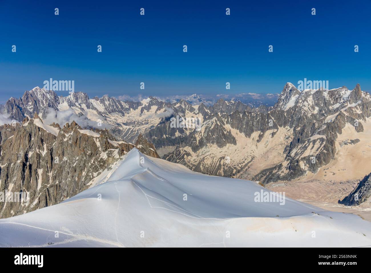 Snow mountain summits and white ice glacier in the Alps. Mont Blanc climbing route and views ...