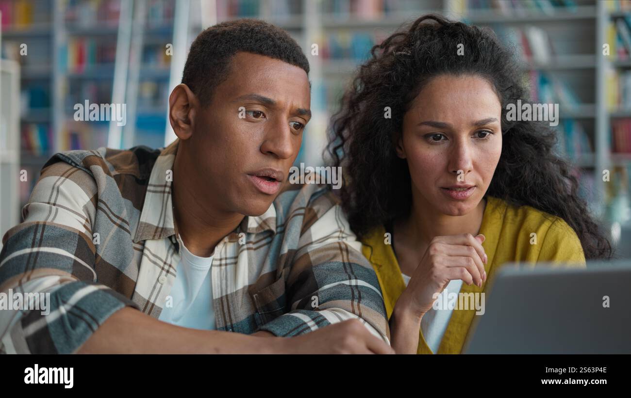 Unhappy Indian Hispanic woman African American man classmates students ...