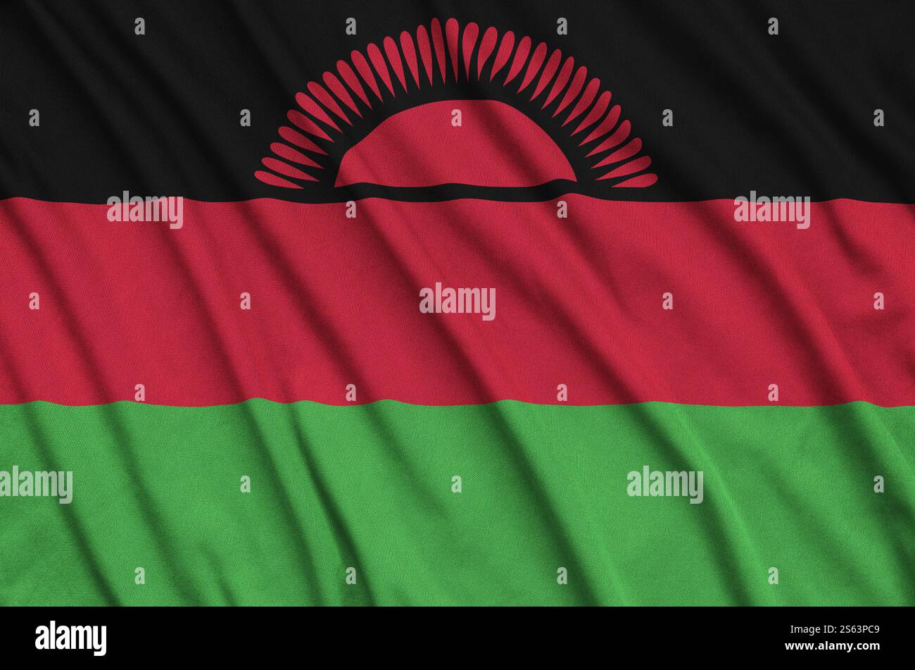 Malawi flag is depicted on a sports cloth fabric with many folds. Sport ...