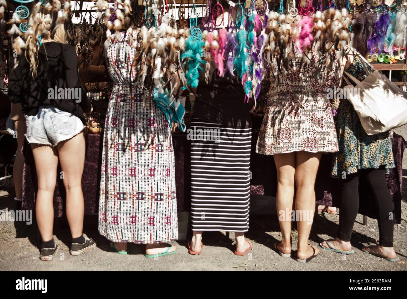 womens legs shot from behind at a market stall Stock Photo - Alamy