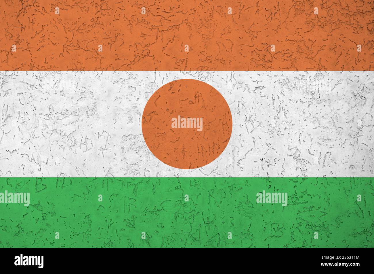 Niger flag depicted in bright paint colors on old relief plastering ...