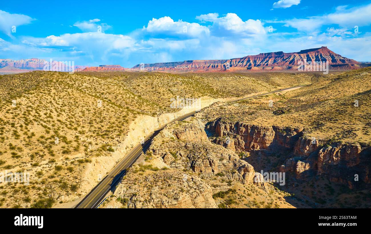 Aerial of Red Rock Formations and Winding Road in Utah Desert Stock ...