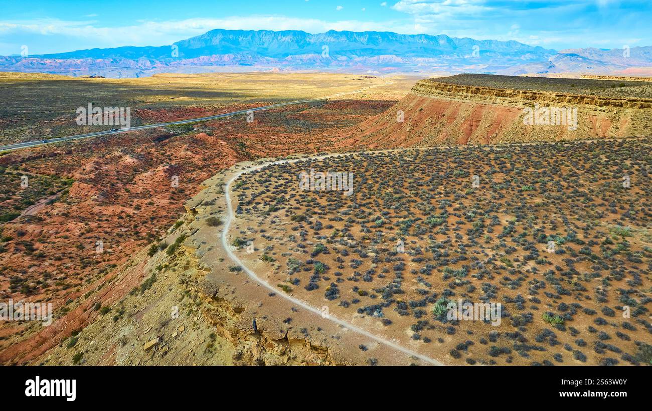 Aerial of Gooseberry Mesa Desert Landscape with Road and Mountains ...