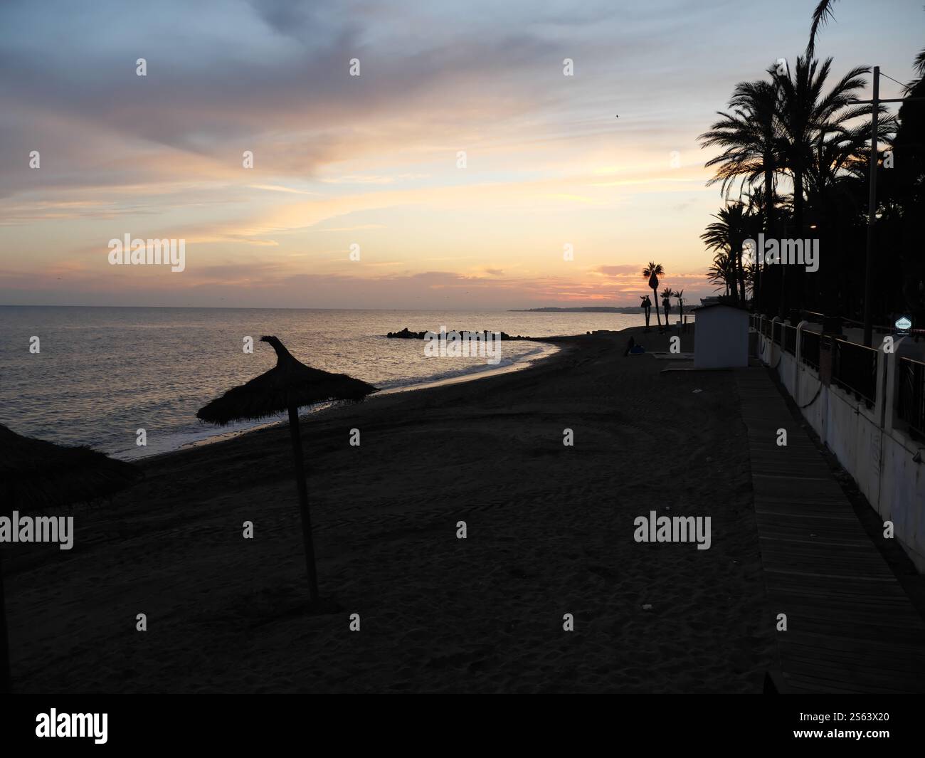 Silhouettes of Plamen in the sunset of Marbella Spain Stock Photo - Alamy