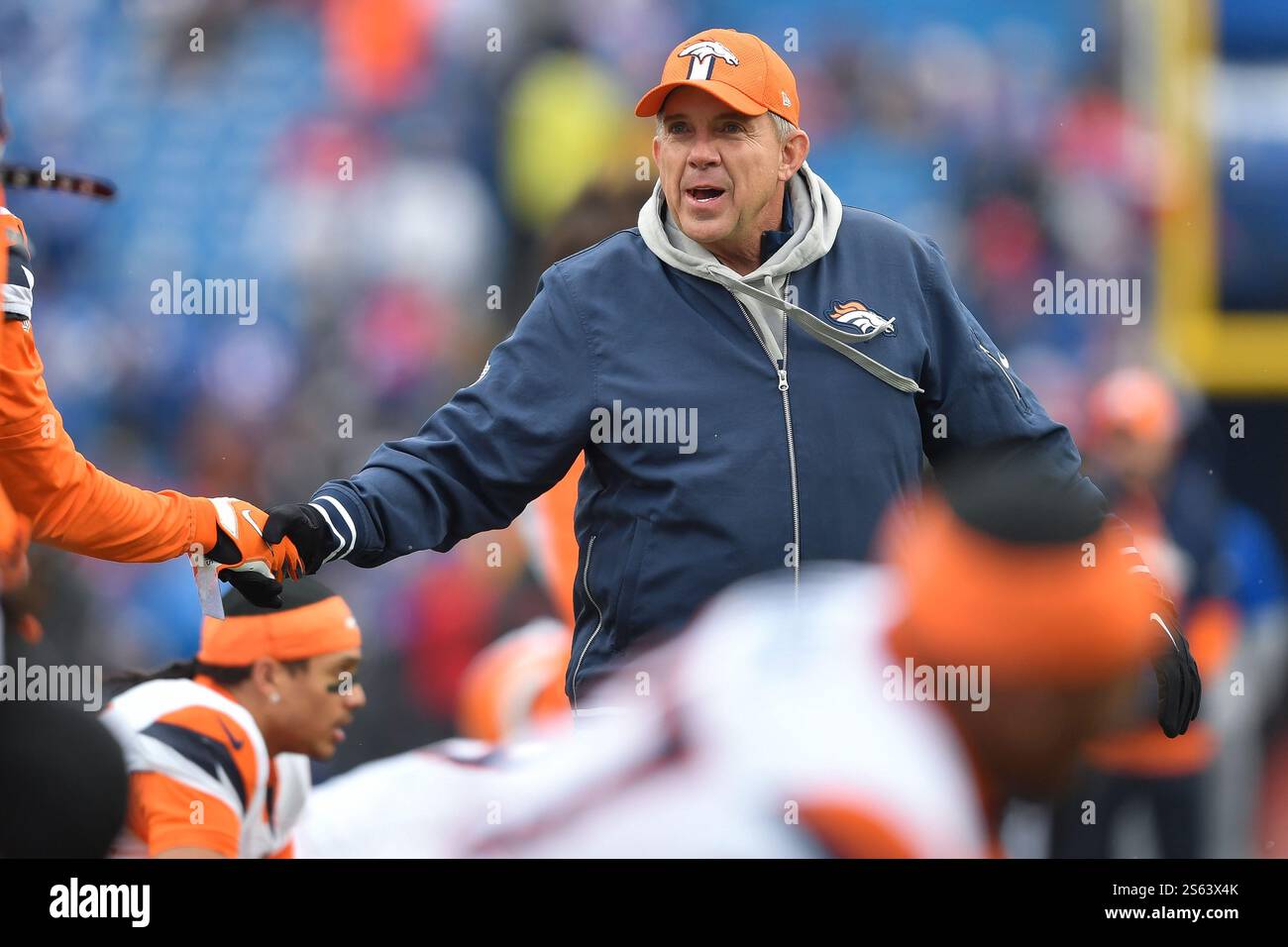 Denver Broncos head coach Sean Payton greets players before an NFL ...