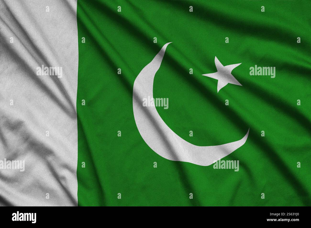 Pakistan flag is depicted on a sports cloth fabric with many folds ...