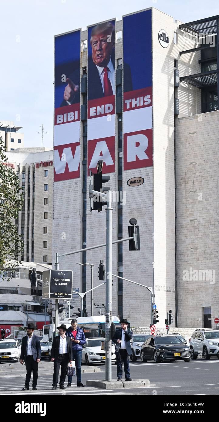 Jerusalem, Israel. 15th Jan, 2025. Orthodox Jews walk under a large ...