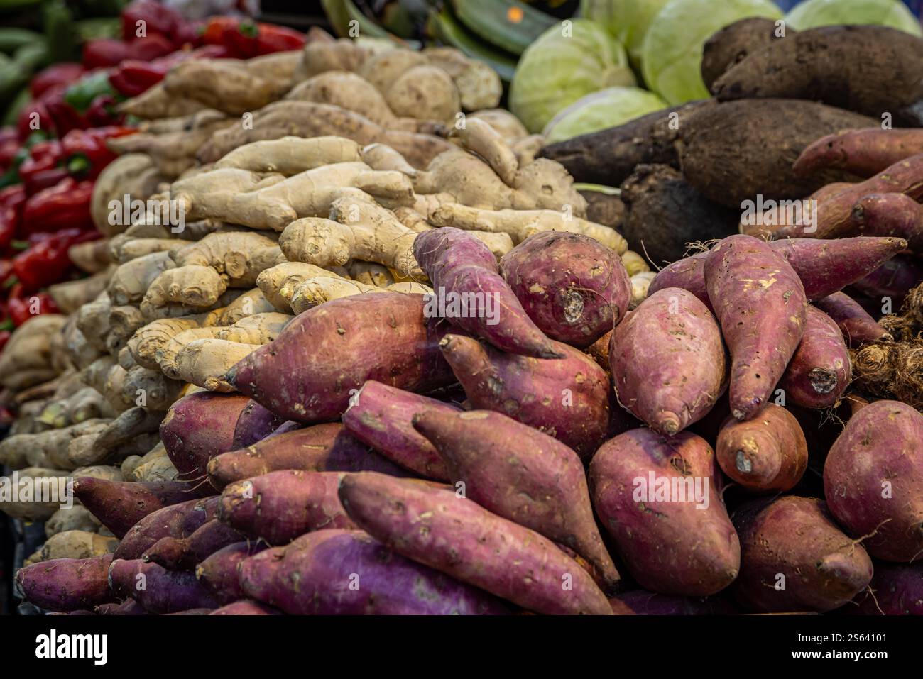 Fresh produce displayed on a market stall, with a shallow depth of ...
