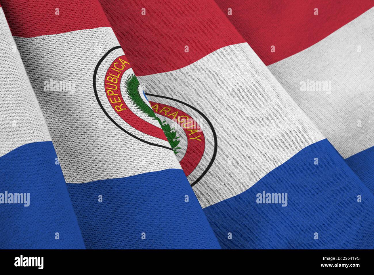 Paraguay flag with big folds waving close up under the studio light ...