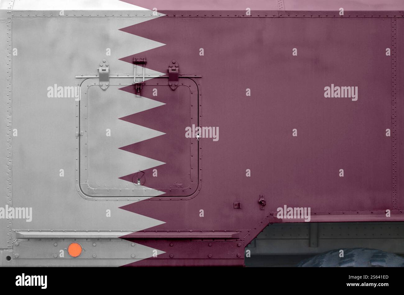 Qatar flag depicted on side part of military armored truck close up ...