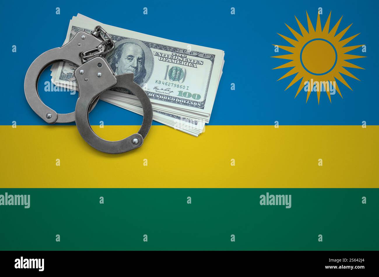 Rwanda flag with handcuffs and a bundle of dollars. The concept of ...
