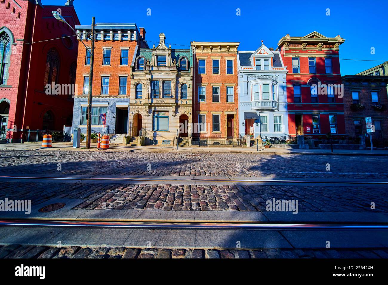 Victorian Architecture on Cobblestone Street with Trolley Tracks Eye ...