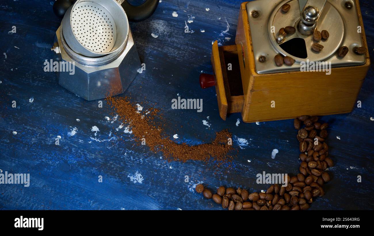 An old-fashioned coffee grinder and an espresso maker Stock Photo - Alamy