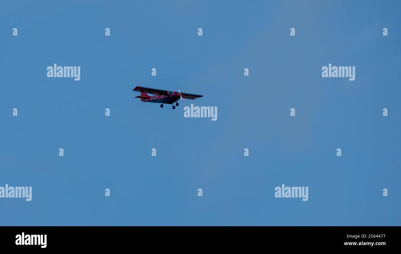 ICP MXP-740 Savannah, a red fixed-wing monoplane, descending to land in ...