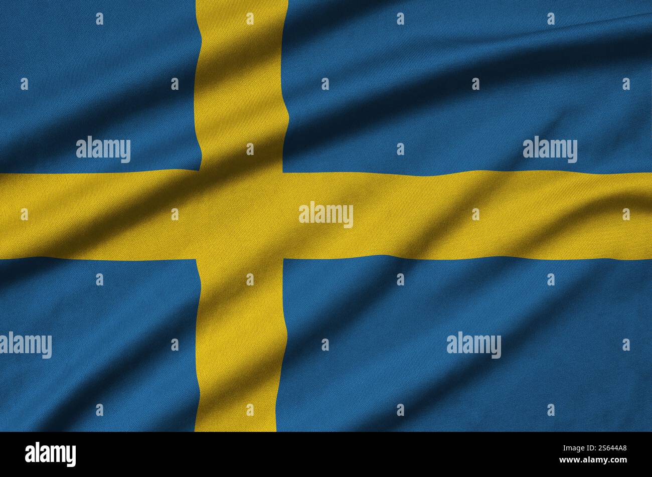 Sweden flag is depicted on a sports cloth fabric with many folds. Sport ...