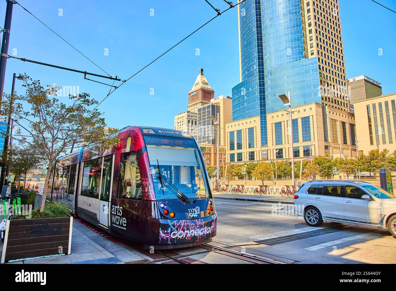 Cincinnati Streetcar in Motion with Urban Skyline Street Level View ...