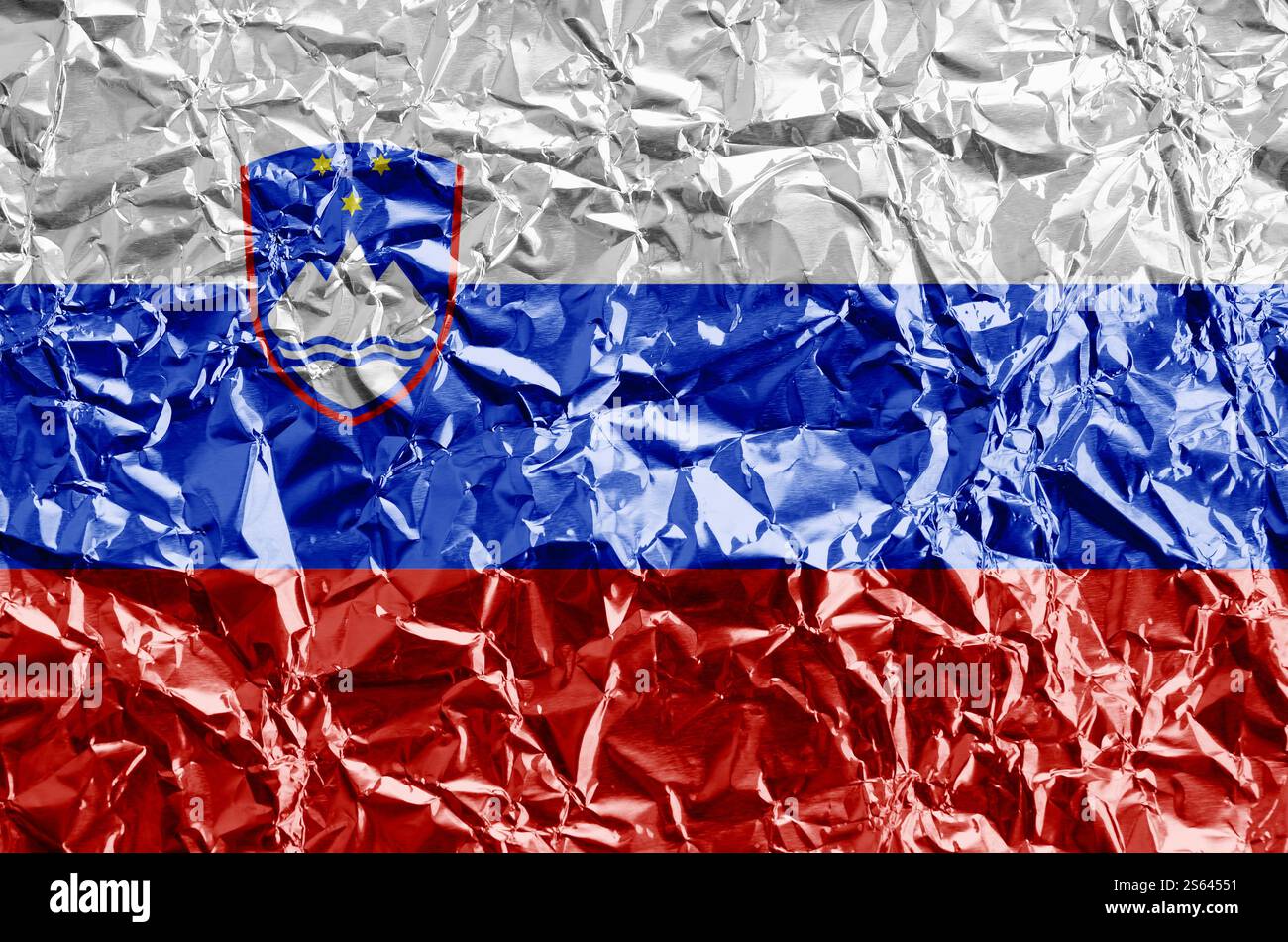 Slovenia flag depicted in paint colors on shiny crumpled aluminium foil ...