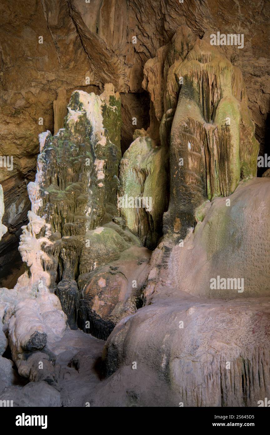 This image showcases a cave interior with intricate stalactite and ...