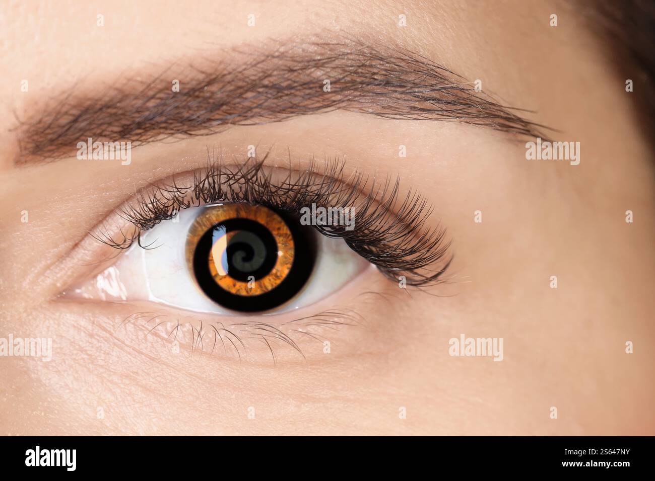 Hypnosis. Spiral symbolizing hypnotic effect in woman's eye, closeup ...