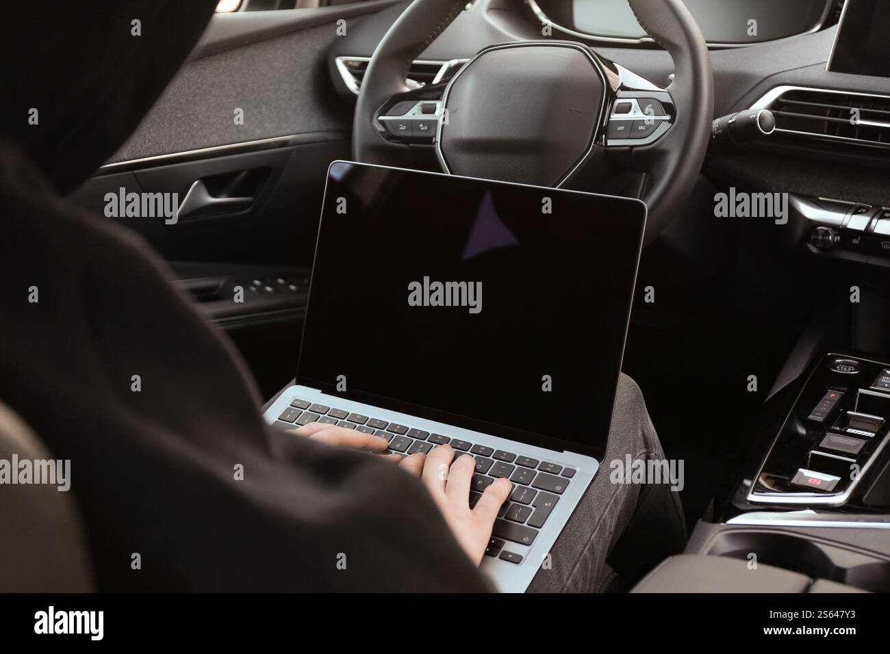 Thief hacking car system with laptop inside vehicle, closeup Stock ...