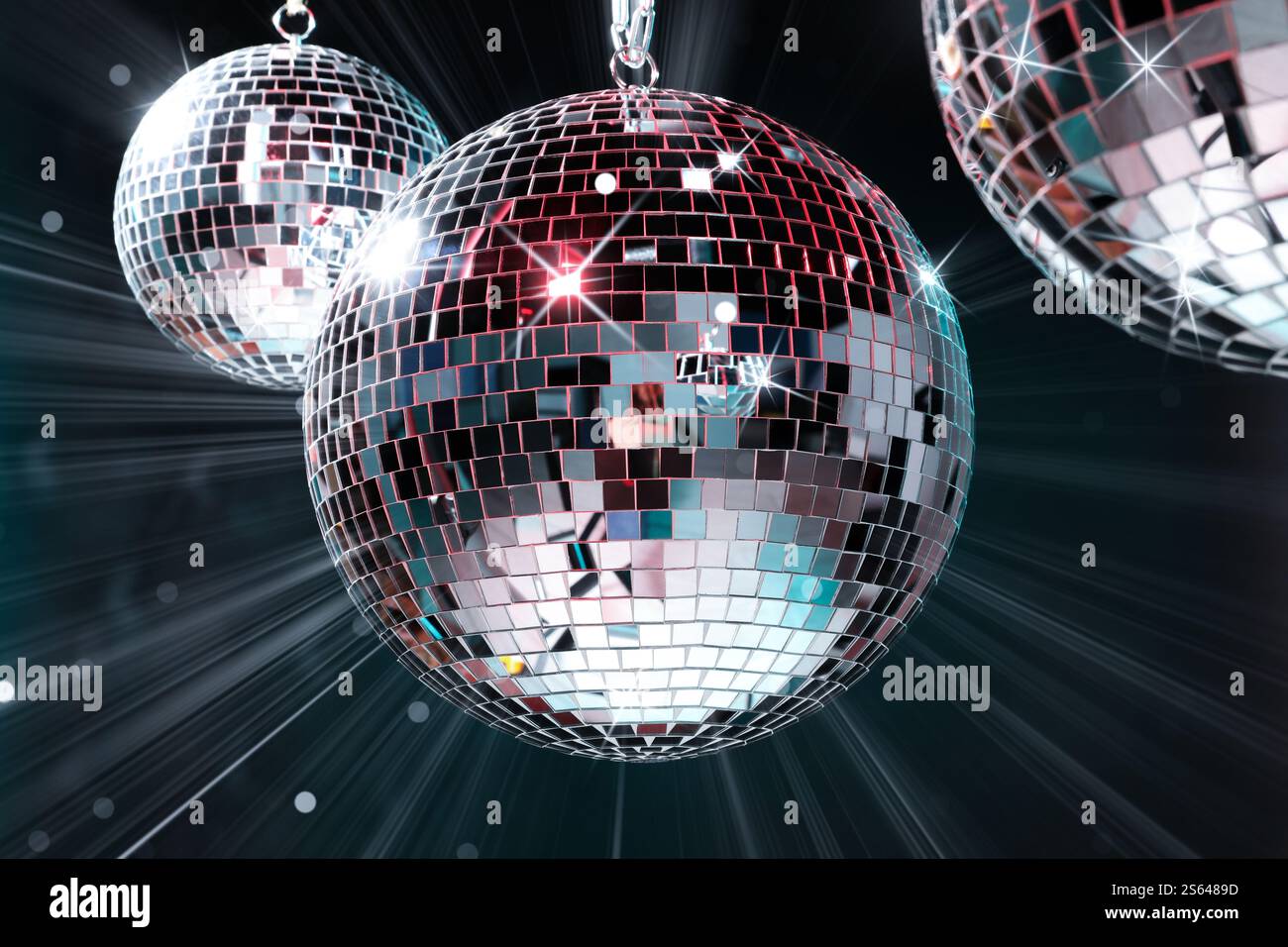 Disco balls reflecting light on dark background. Nightclub decor Stock ...