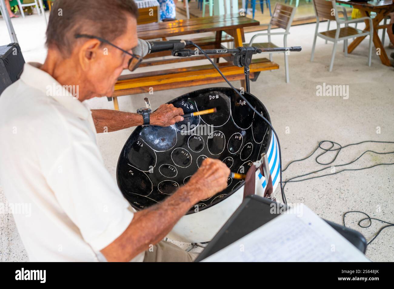 A musician plays a steel pan drum wile performing at Crab Island Rum ...