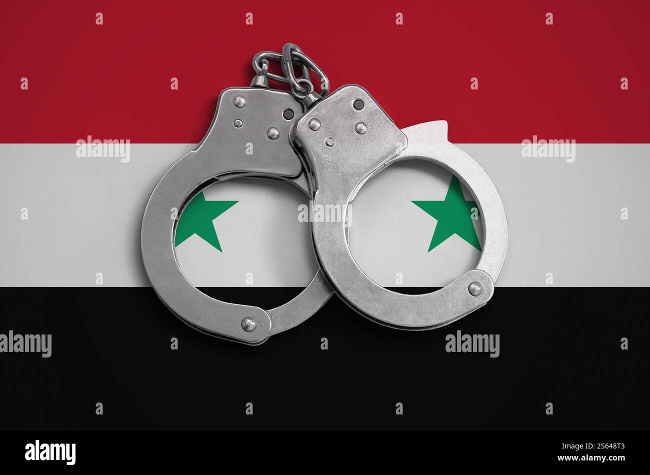 Syria flag and police handcuffs. The concept of observance of the law ...