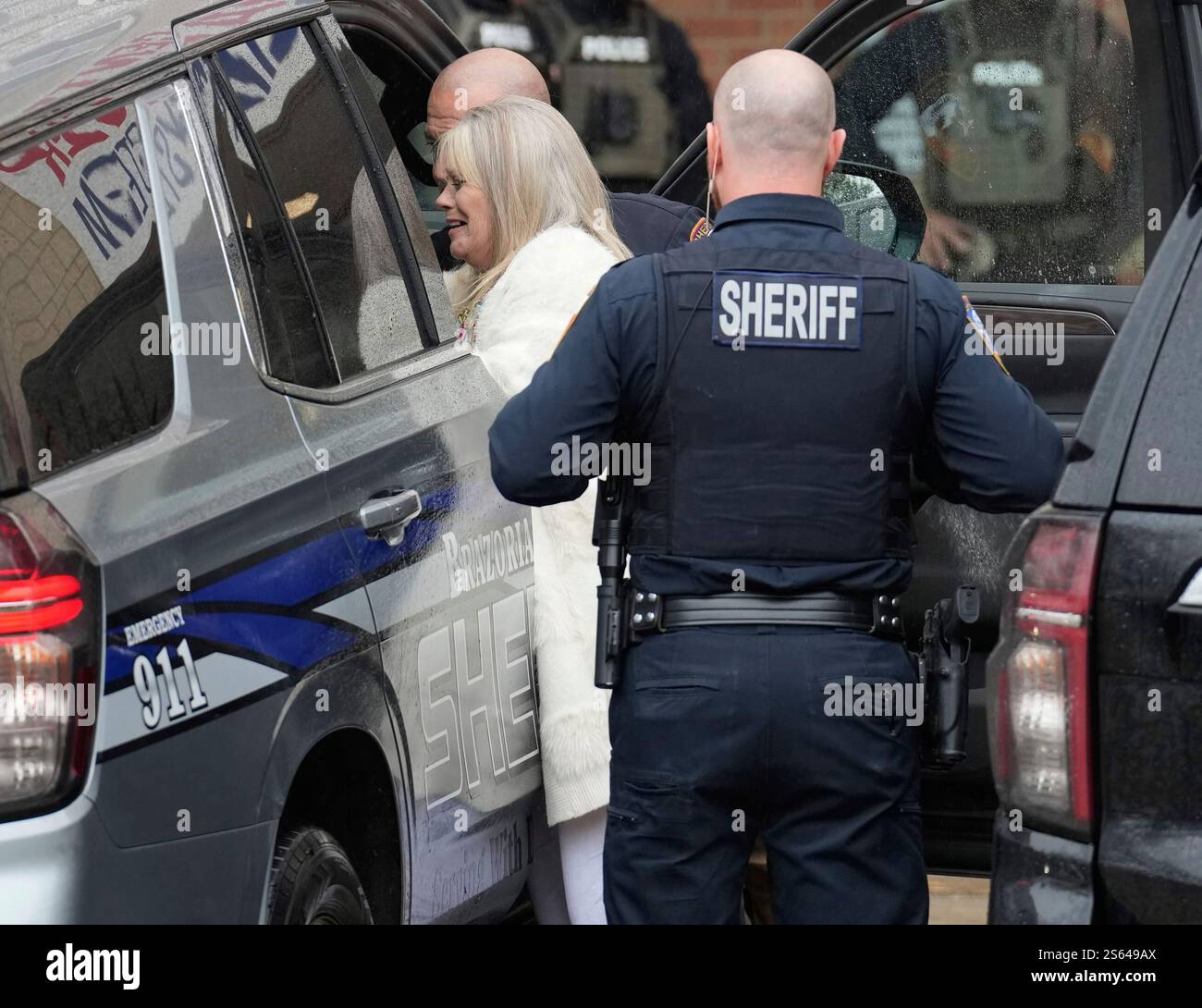 People arrive at Ben Taub Hospital with deputy sheriffs from Brazoria County where a Texas ...