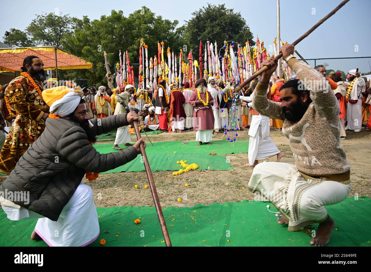 Prayagraj, India. 08th Jan, 2025. Sadhus showing their skill during ...