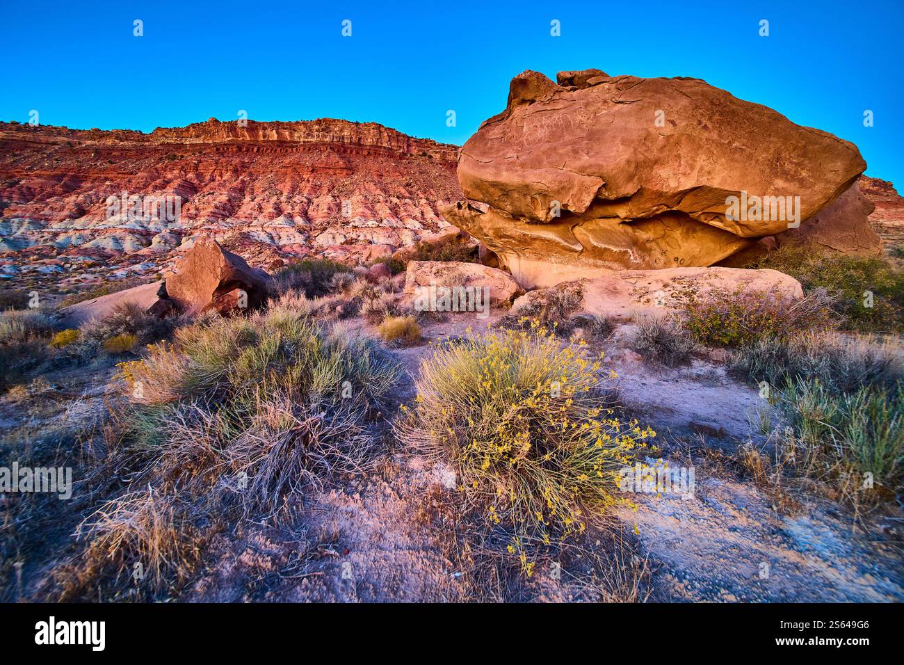 Desert Boulder and Striated Cliffs at Golden Hour Eye Level Perspective ...