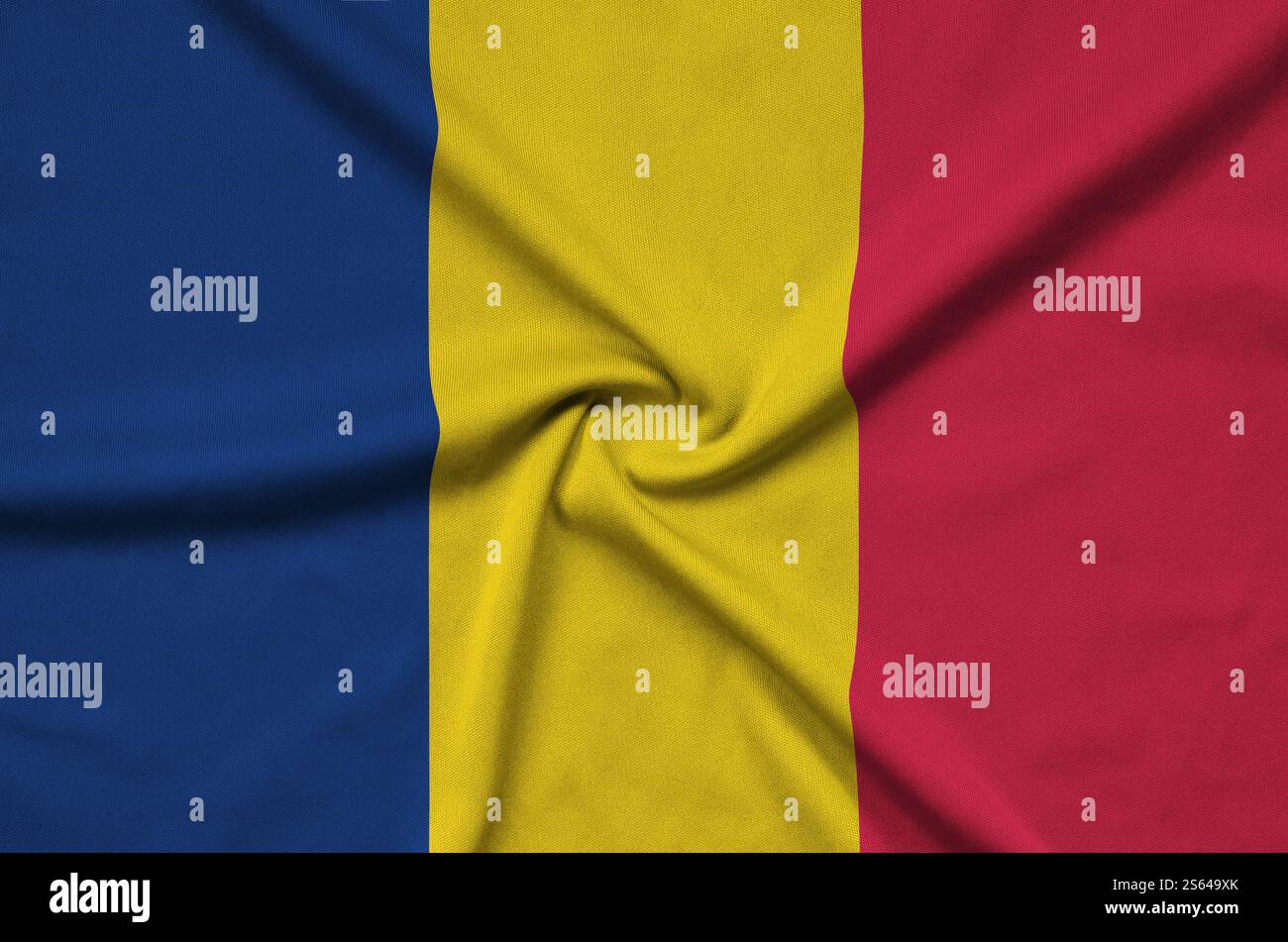 Chad flag is depicted on a sports cloth fabric with many folds. Sport ...
