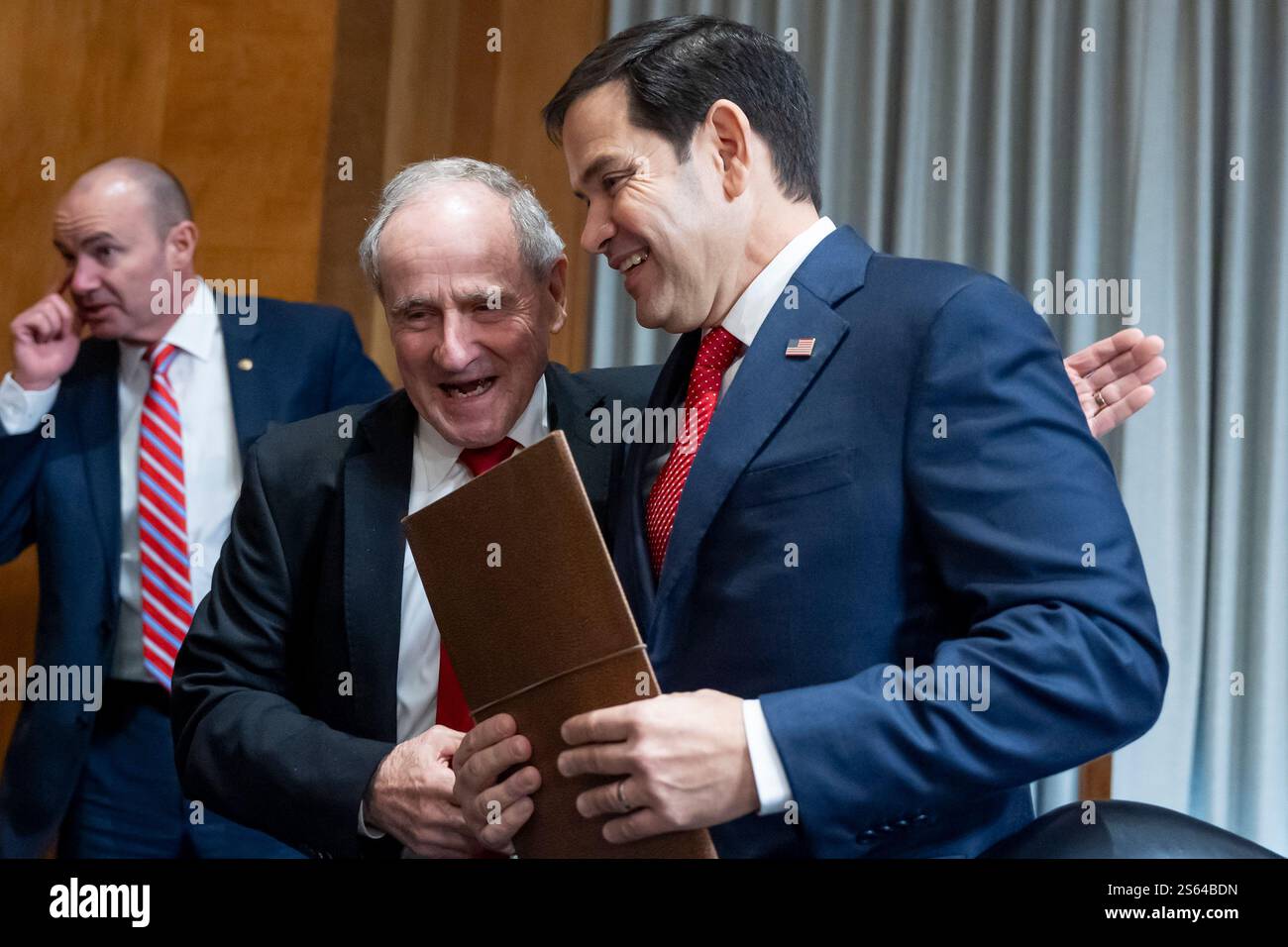 Chairman Jim Risch, of Idaho, second from left, embraces Sen. Marco ...