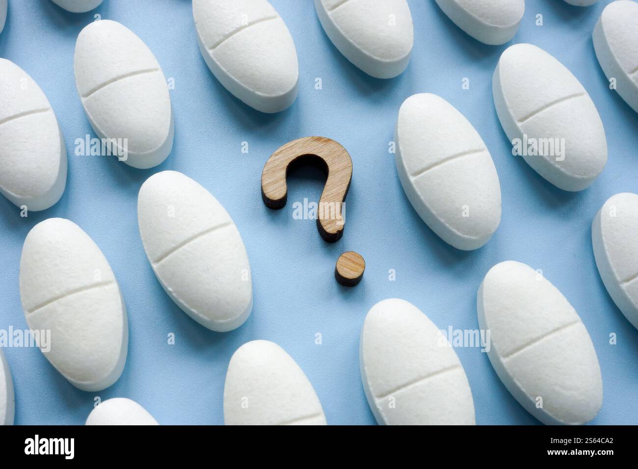 Medical pills and question mark. Side effects and health risks Stock ...