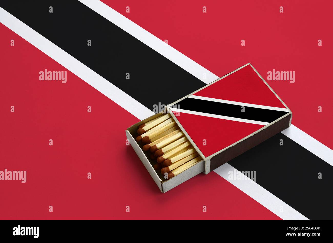 Trinidad and Tobago flag is shown in an open matchbox, which is filled ...