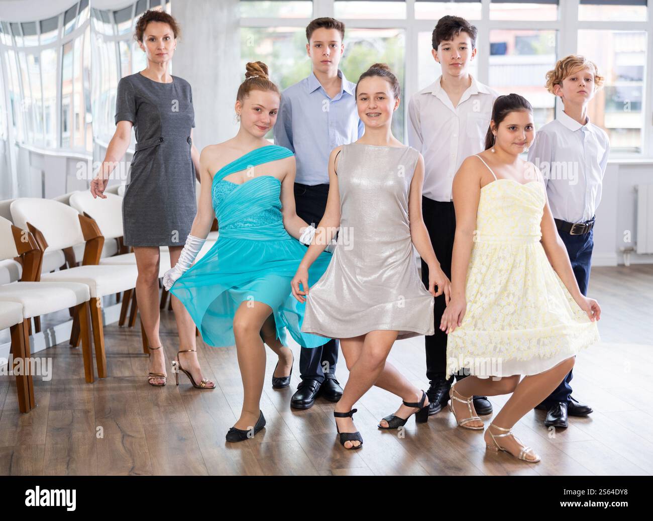Teen girls curtsy and pose with ballroom dancing boys partners for ...