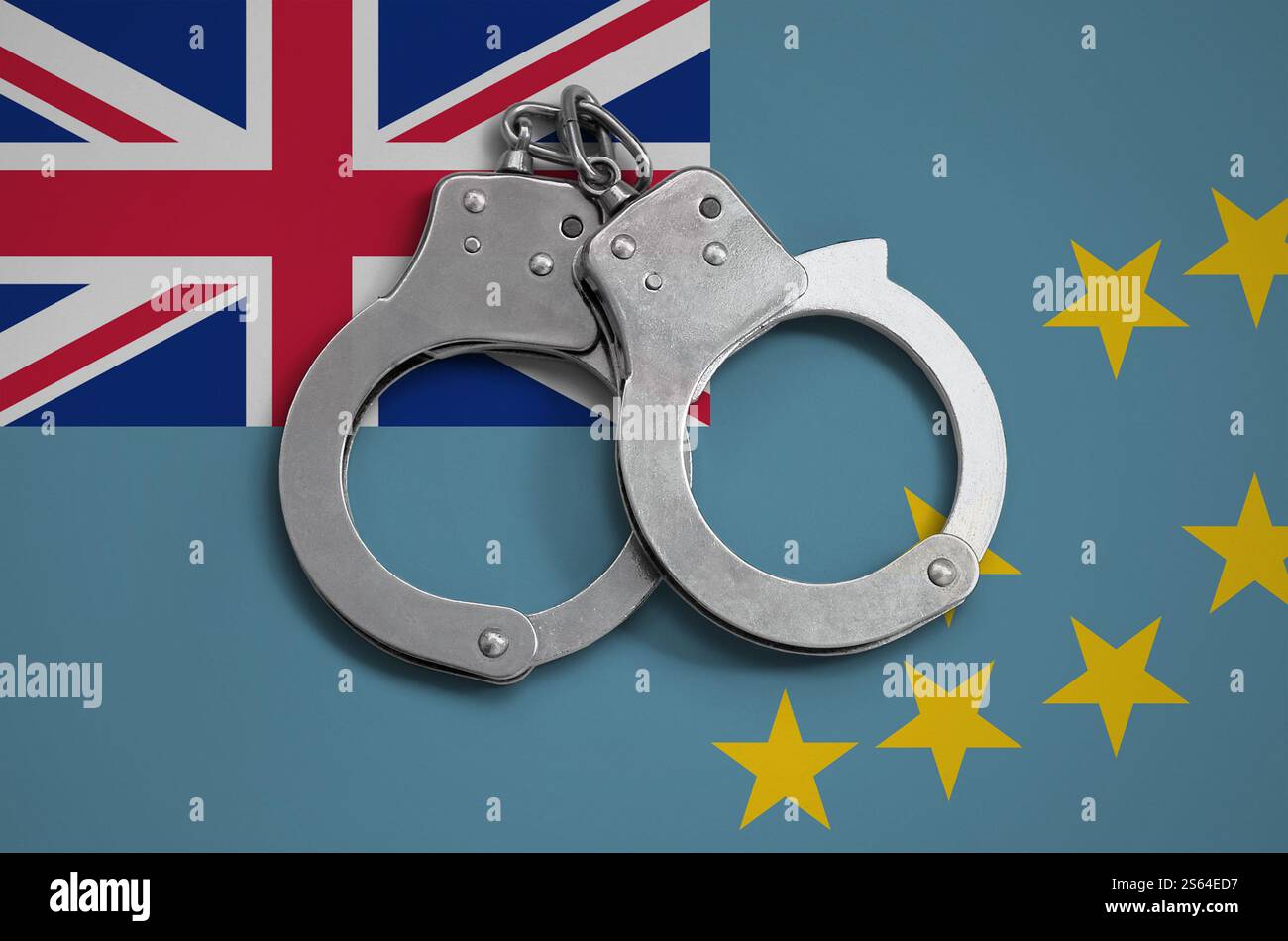 Tuvalu flag and police handcuffs. The concept of observance of the law ...
