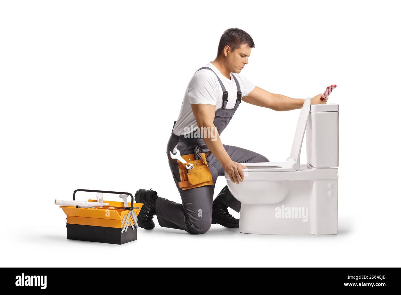 Worker repairing a toilet seat isolated on white background Stock Photo ...