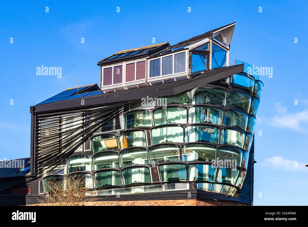 modern house and architects studio with large glass windows possibly ...