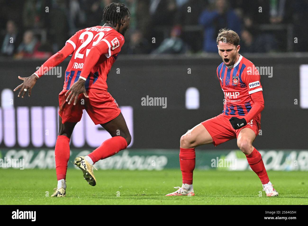 Heidenheim's Leonardo Scienza, right, celebrates after scoring his side ...