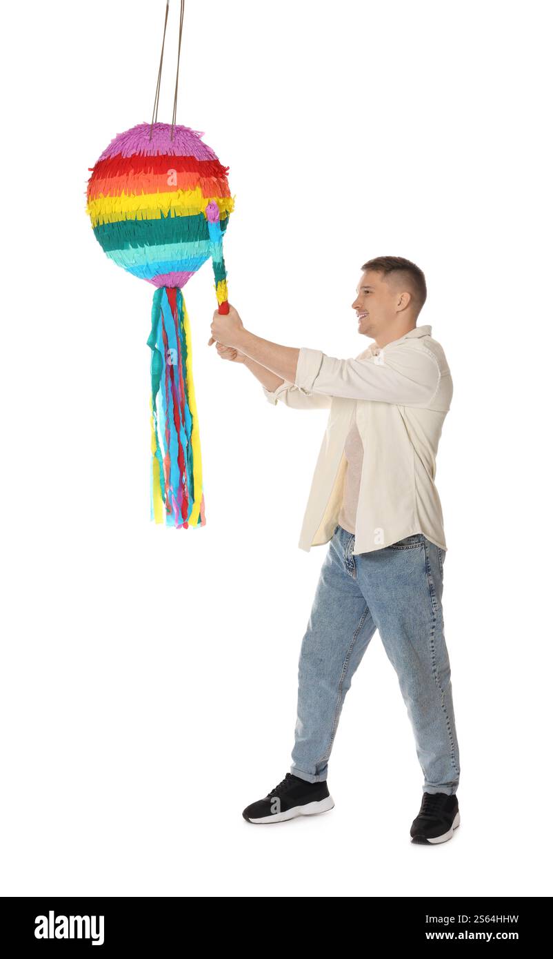 Happy man breaking pinata on white background Stock Photo - Alamy