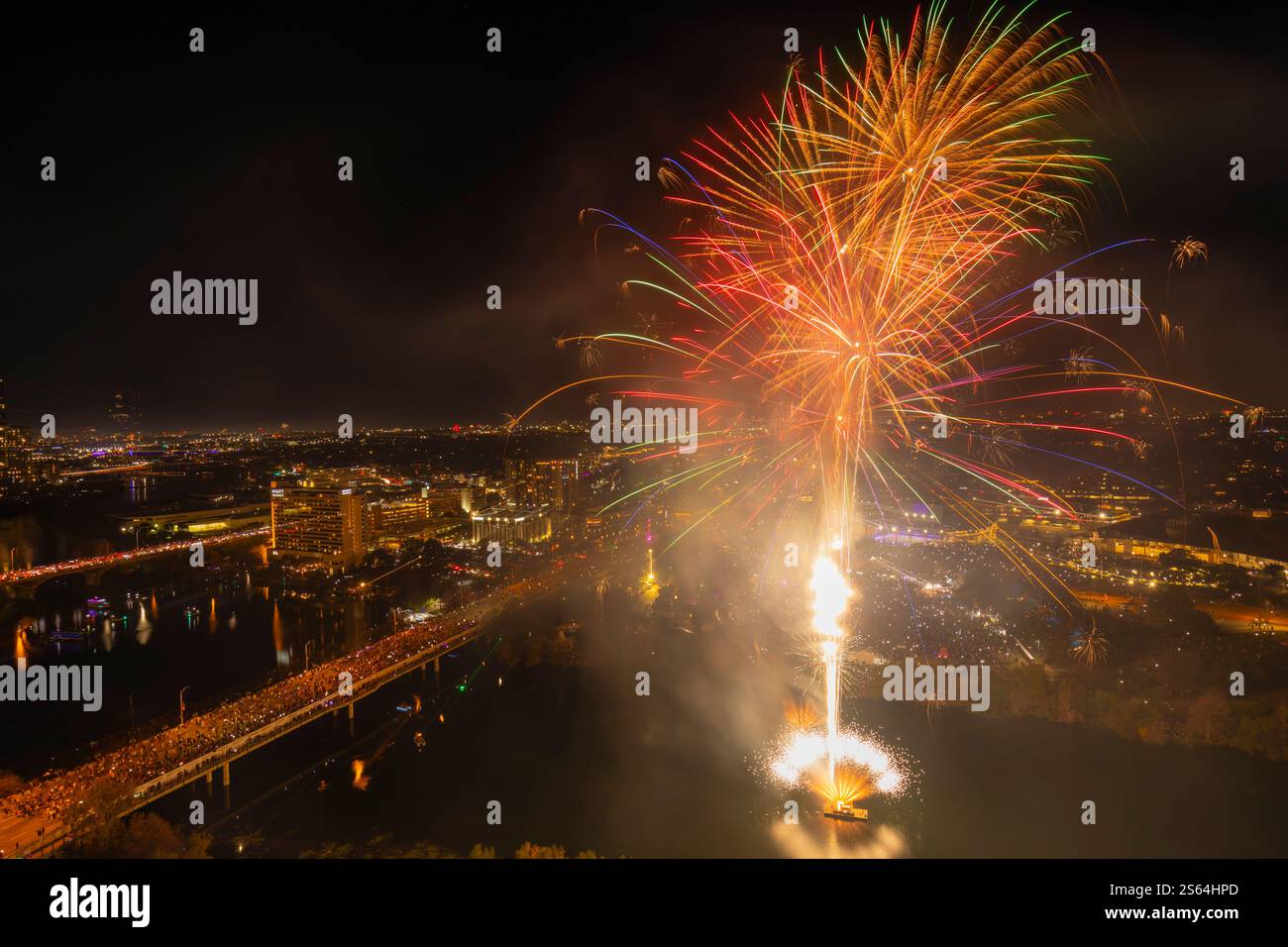 Elevated view of Fireworks launching from barge on LadyBird Lake in ...