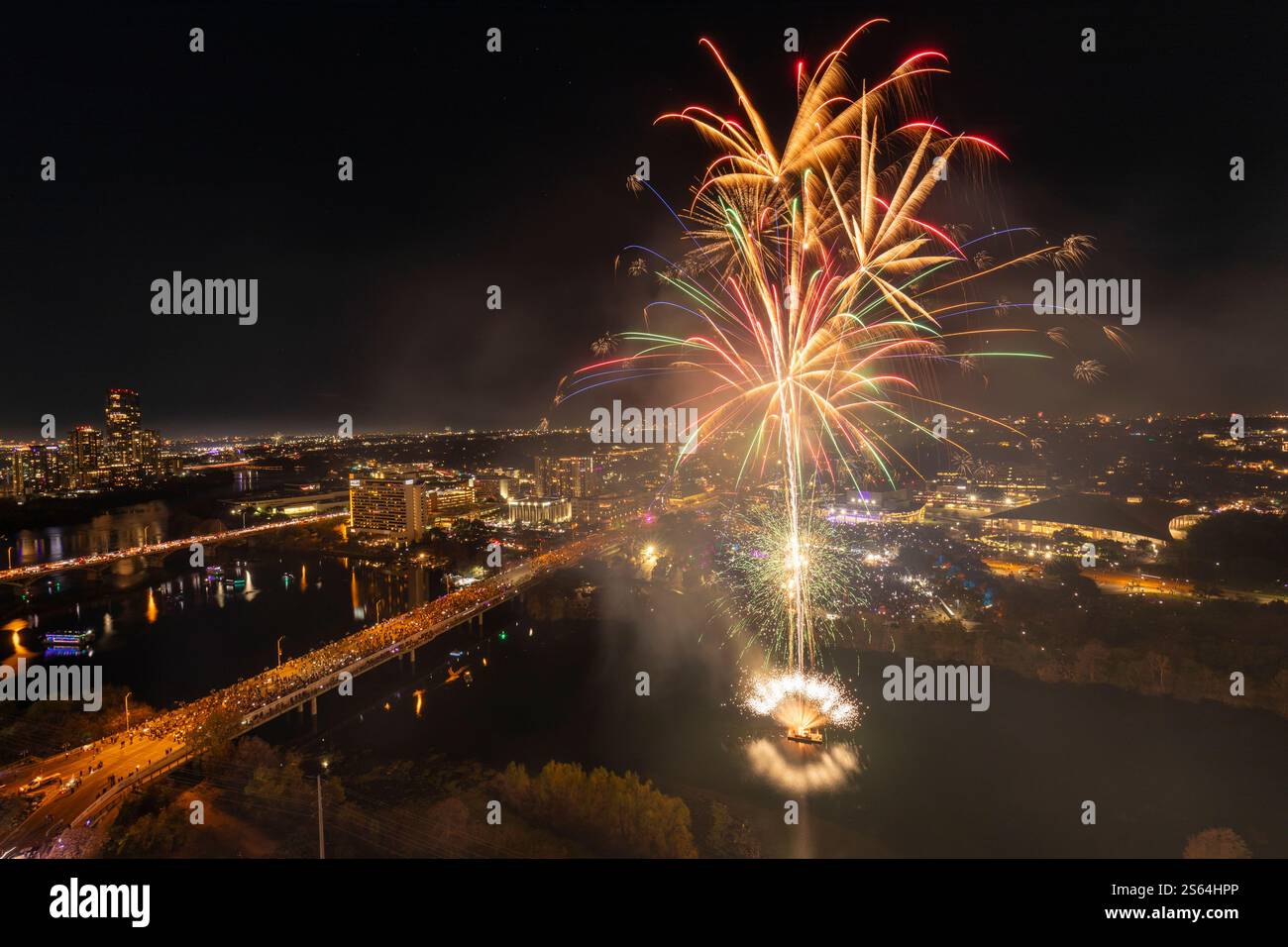Elevated view of Fireworks launching from barge on LadyBird Lake in ...