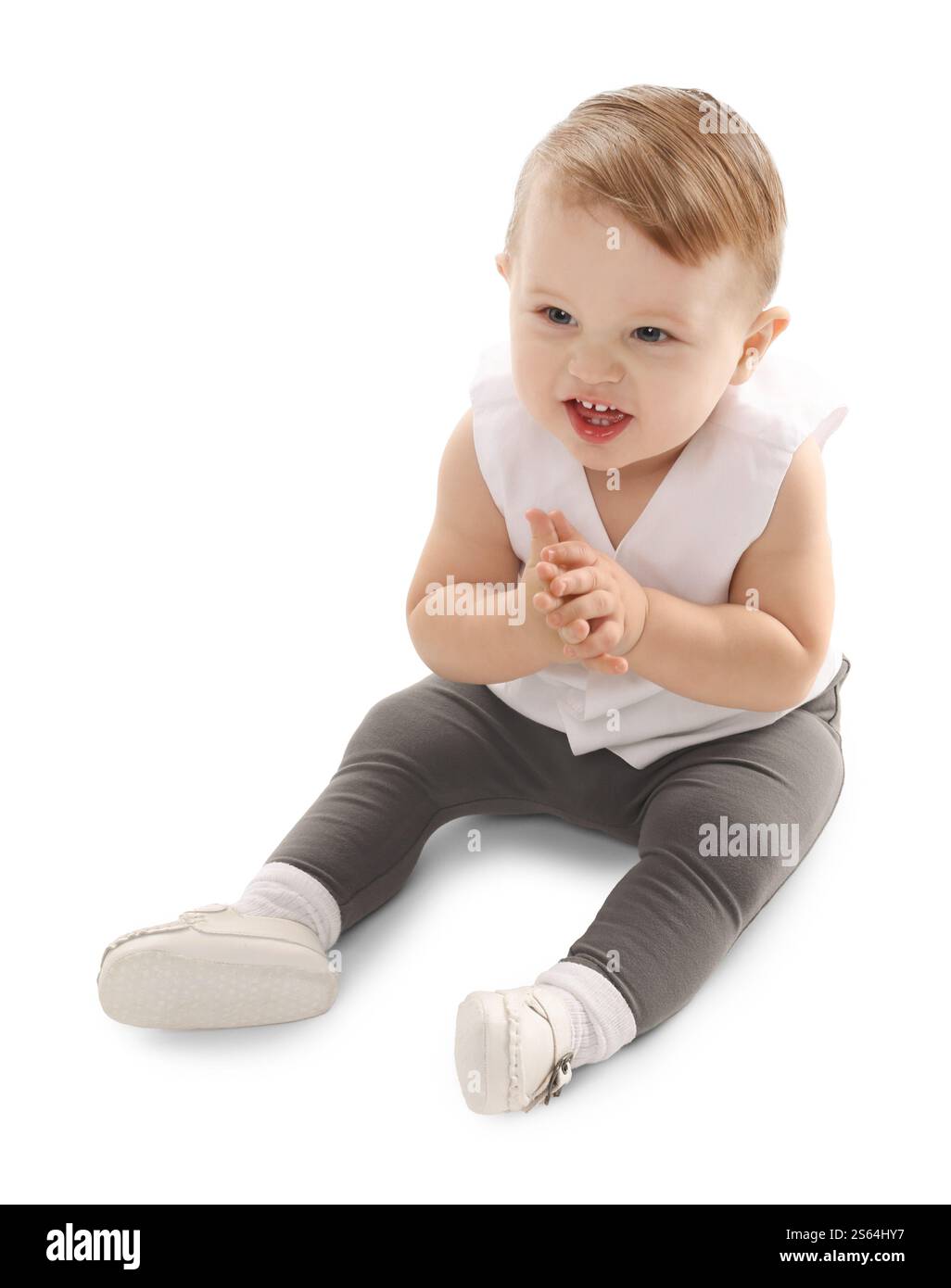Cute little baby sitting on white background Stock Photo - Alamy