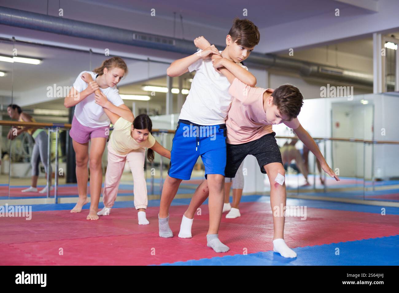 Kids learning self-defence moves in gym Stock Photo - Alamy