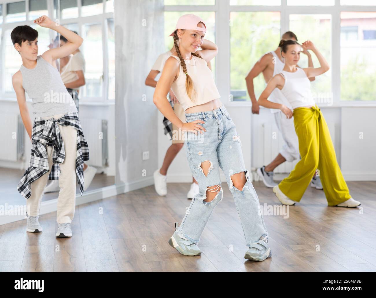 Teenage girl dancing jazz funk in group Stock Photo - Alamy